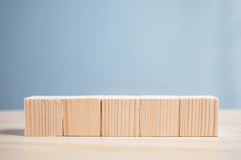 Wood Empty Five Blocks on Table and Blue Blackground with Copy Space ...