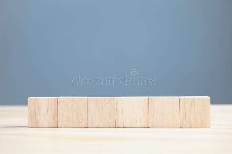 Wood Empty Six Blocks on Table and Blue Blackground with Copy Space for ...