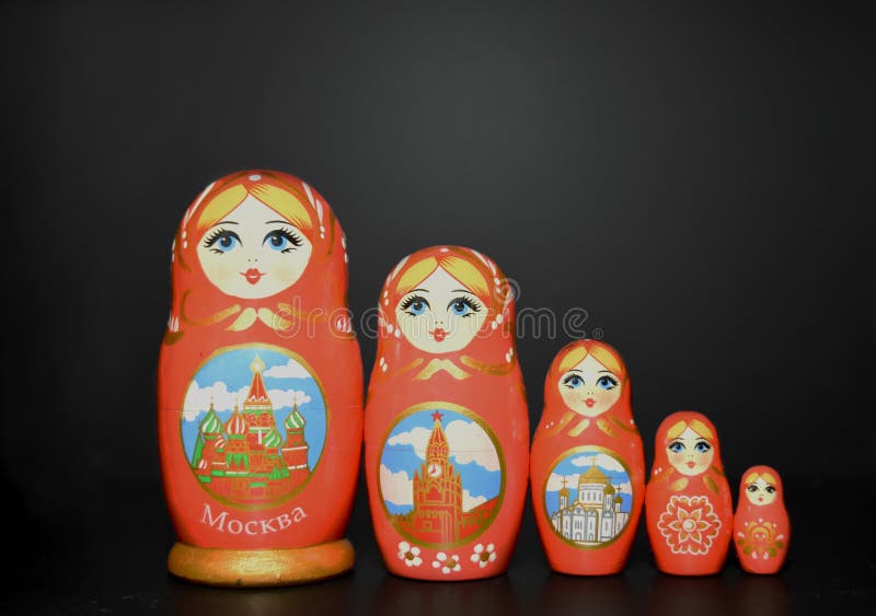 Wood Five Red Nesting Dolls on a Black Surface Stock Image - Image of ...