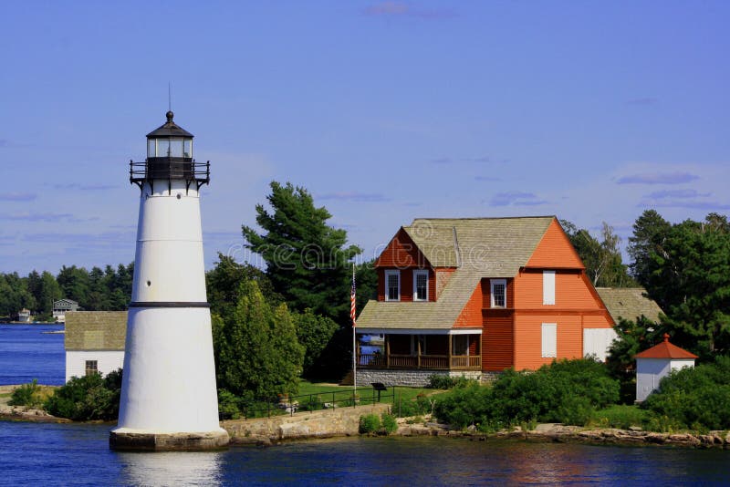 Wood House Cottage and Lighthouse on the River Stock Photo - Image of ...