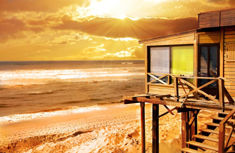 Wood house on the sunset stock image. Image of island - 23502005