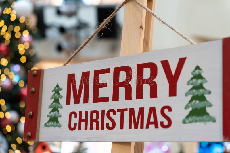 Wood Merry Christmas Sign Hanging on the Timber Column Stock Image ...