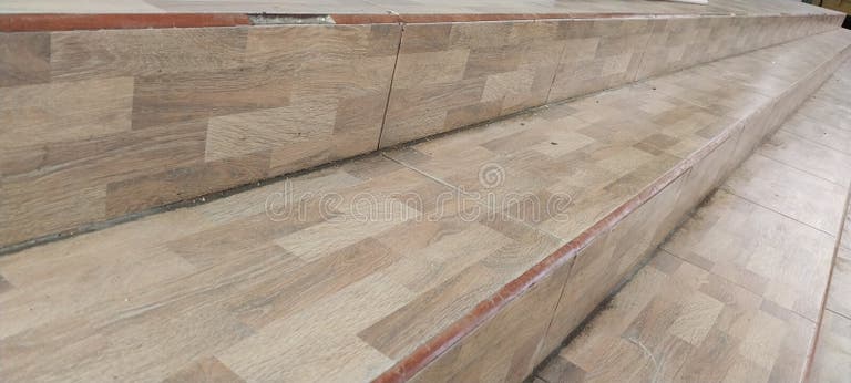 Wood Patterned Tile Steps with a Brown Trim, Slightly Worn and Dusty ...