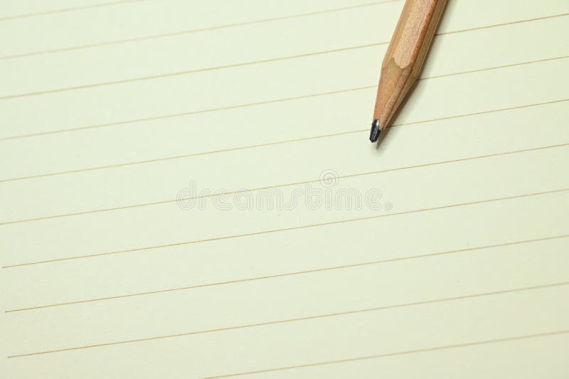 Close Up Brown Wood Pencil on White Notebook Stock Image - Image of ...