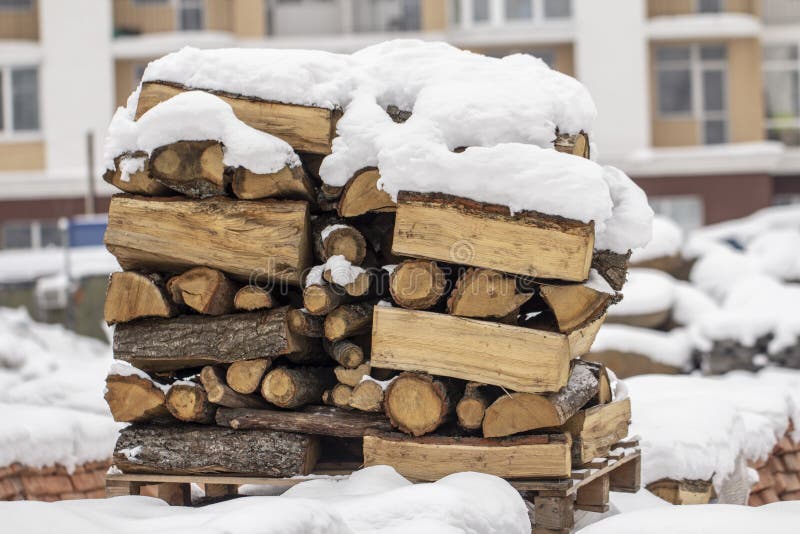 Wood Pile Stack of Firewood Under the Snow. Stack of Cut Wood Under the ...
