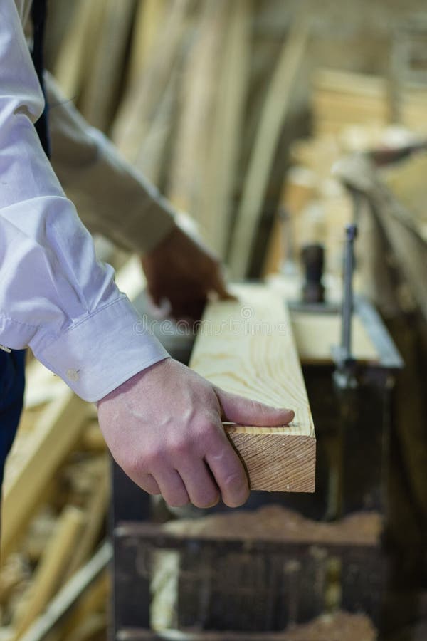 Wood Processing. Confident Young Male Carpenter Working with Wood in ...