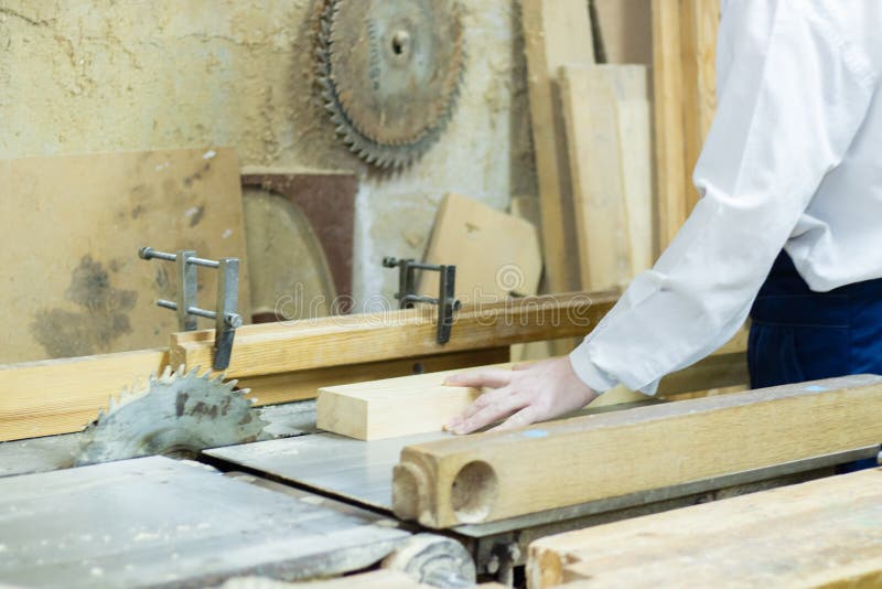 Wood Processing. Confident Young Male Carpenter Working with Wood in ...