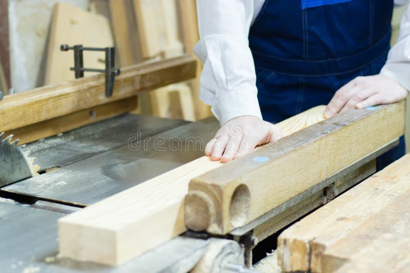 Wood Processing. Confident Young Male Carpenter Working with Wood in ...