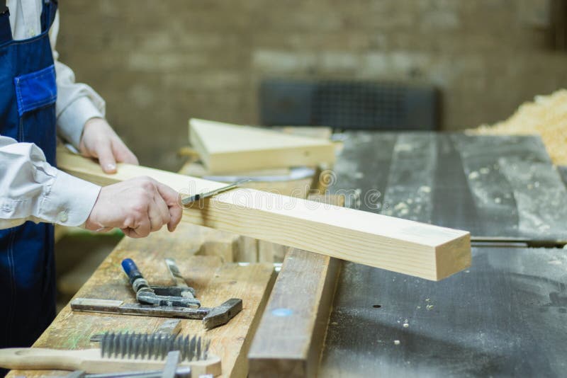 Wood Processing. Confident Young Male Carpenter Working with Wood in ...