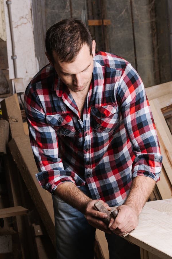 Wood Processing. Confident Young Male Carpenter Working with Wood Stock ...