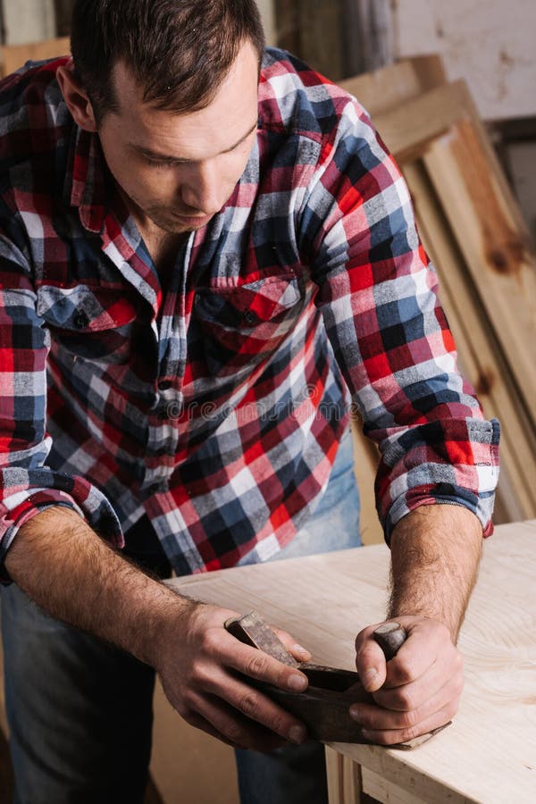 Wood Processing. Confident Young Male Carpenter Working with Wood Stock ...