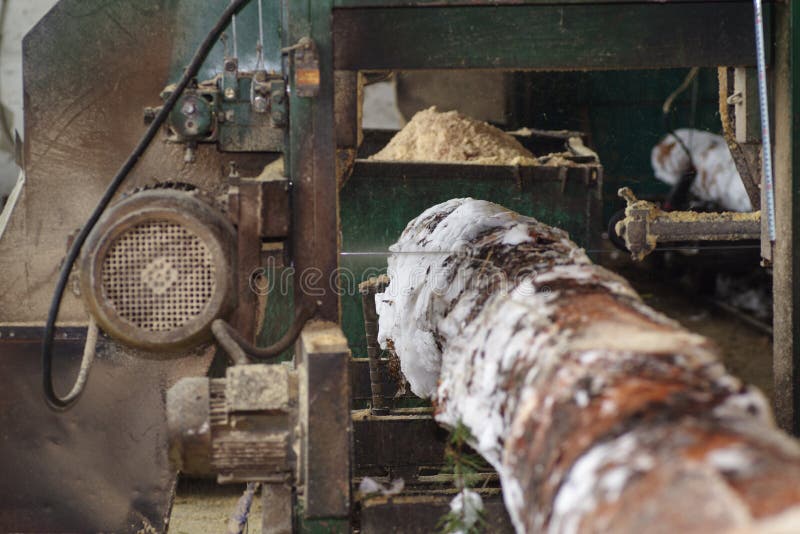Wood Processing. Cutting Logs on the Boards. in the Winter Process a ...