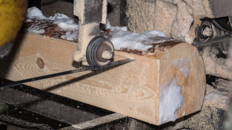 Wood Processing. Cutting Logs on the Boards. in the Winter Process a ...