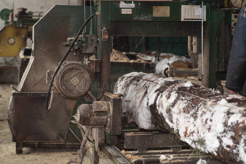 Wood Processing. Cutting Logs on the Boards. in the Winter Process a ...