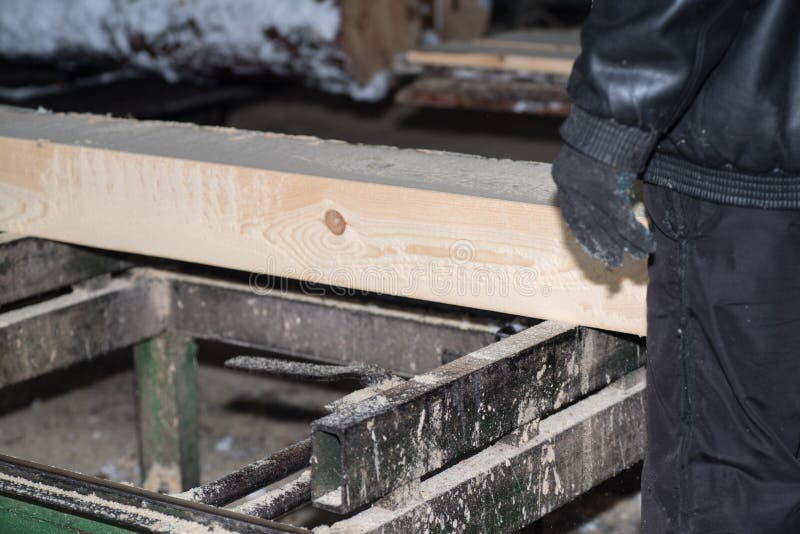 Wood Processing. Cutting Logs on the Boards. in the Winter Process a ...