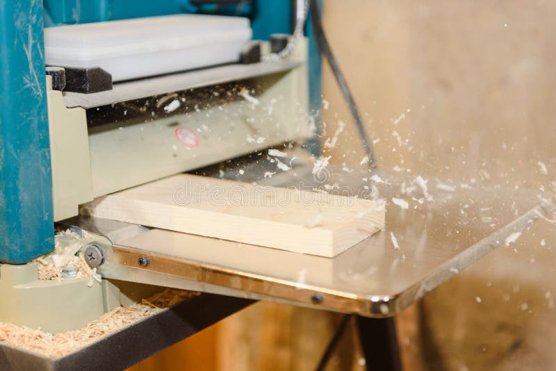 Wood Processing on the Machine. Flies Shavings. Level the Board Stock ...