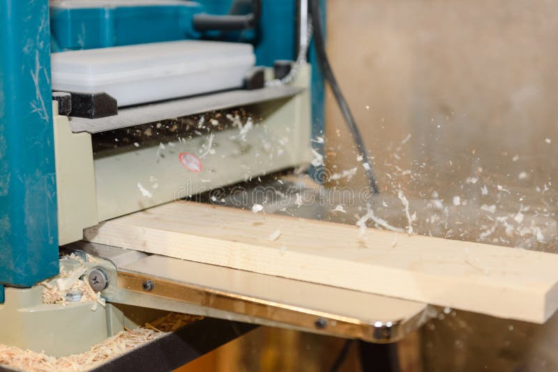 Wood Processing on the Machine. Flies Shavings. Level the Board Stock ...