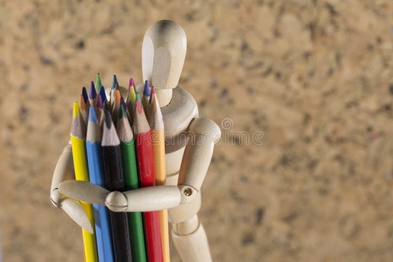 Wood Puppet with Pencils stock photo. Image of color - 72059994