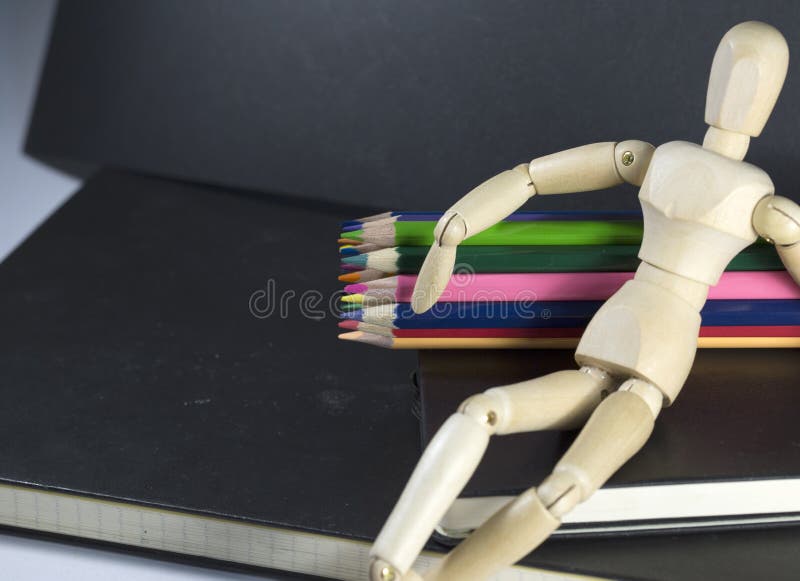 Wood Puppet Sitting on Sketchbook Stock Image - Image of designer ...