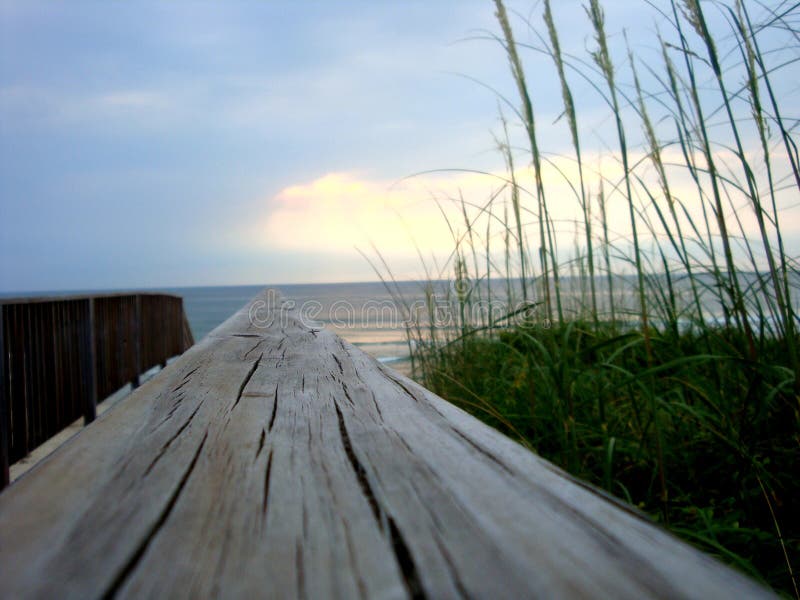 Wood rail on the beach stock image. Image of cloud, sand - 267627801