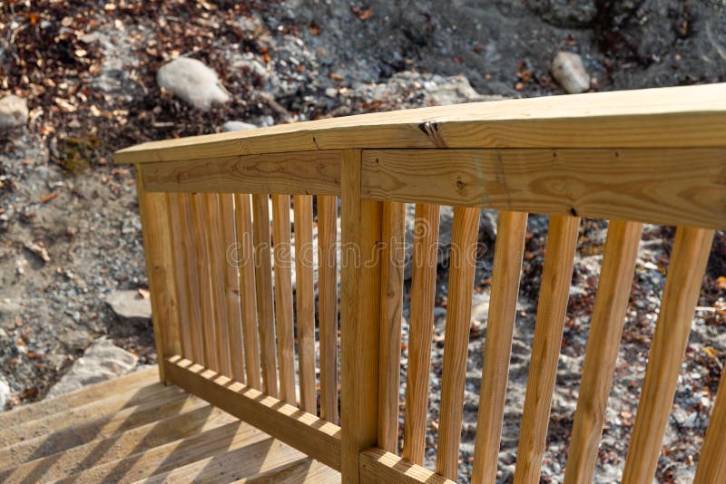 Wood Railing Going Down To a Rocky Beach in Maine in the Springtime ...
