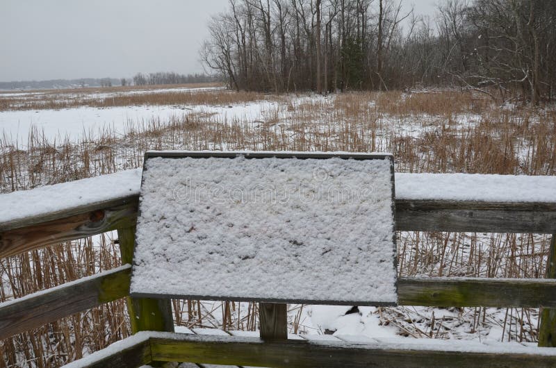 Wood Railing and Information Plaque Covered in Snow Along the Potomac ...