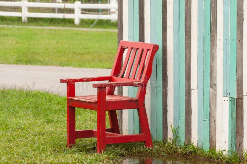 Wood Red Bench in Front of Multi Colour Wall. Stock Image - Image of ...