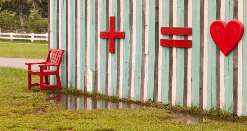Wood Red Bench in Front of Multi Colour Wall. Stock Image - Image of ...