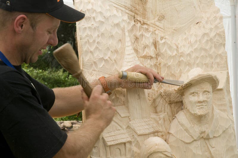 Wood Sculptor at a Workbench Carving a Wooden Figure Stock Photo ...