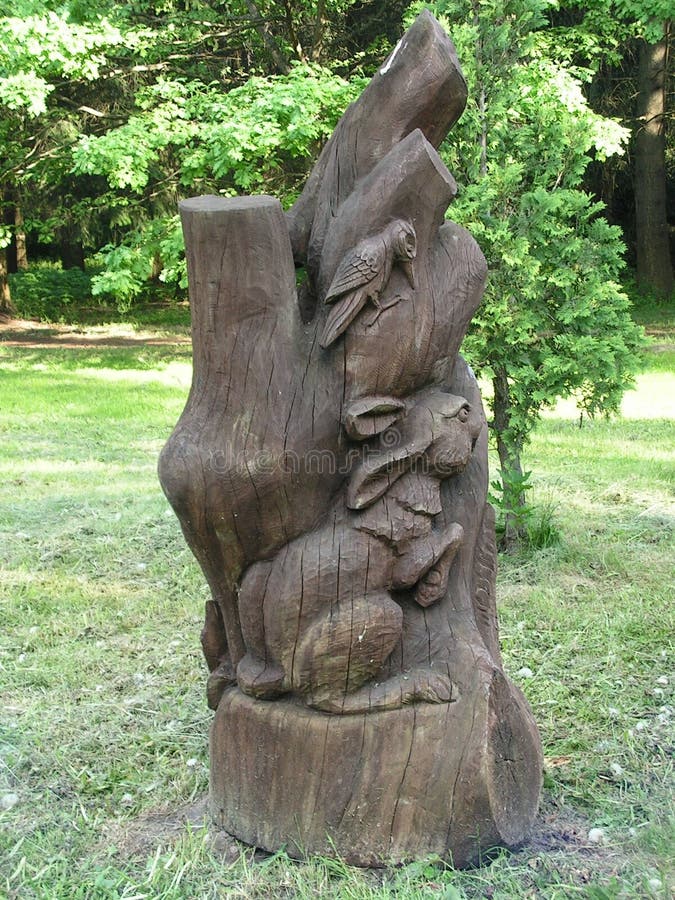 Wood Sculpture. Forest Users.Landscape Area in the Rays of the Setting ...