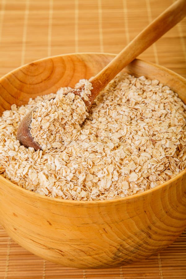 Wood Spoon in Bowl of Oatmeal Stock Image - Image of cereal, dieting ...