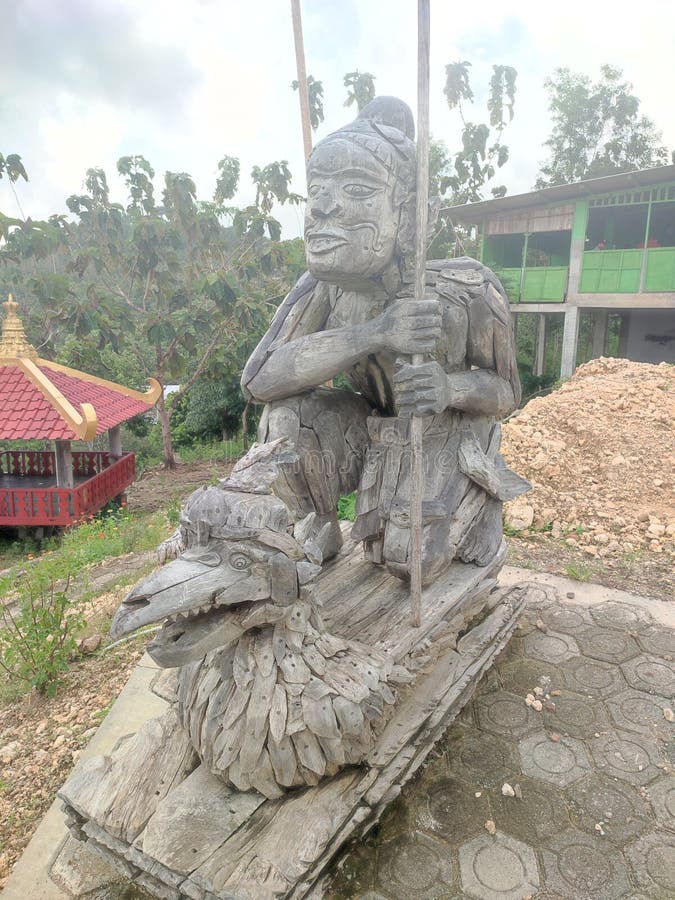 Wood Statue of Man and Bird Stock Photo - Image of bird, wood: 262472284