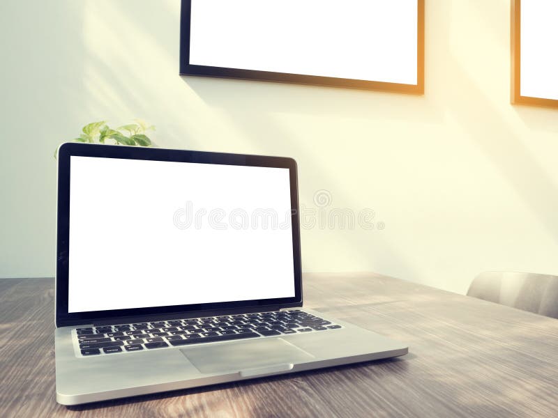 Wood Table with Blank Screen on Laptop Computer with Picture Frame at ...