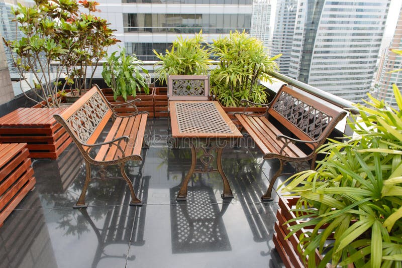 Wood Table and Chairs on Rooftop Stock Photo - Image of terrace, garden ...