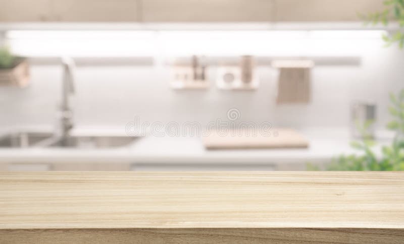 Wood Table Top Counter Island on Blur Cozy Kitchen Stock Photo - Image ...