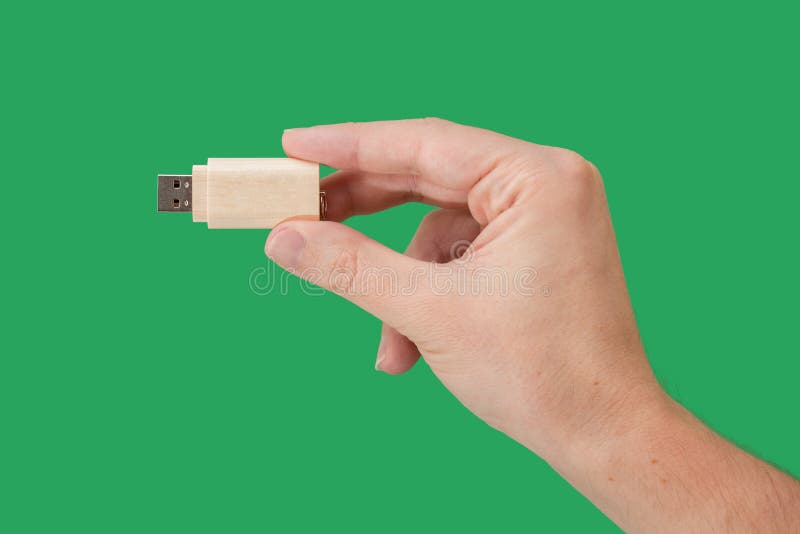 Wood USB Memory Stick on Hand with Green Background Stock Photo - Image ...