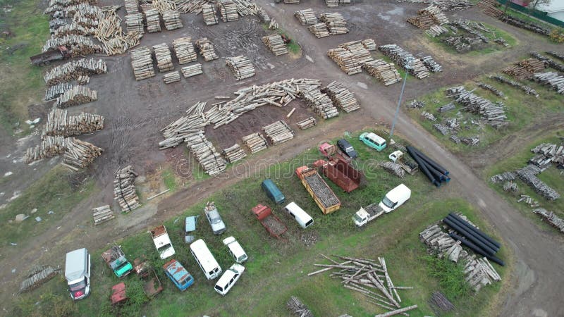 Tree Logs Being Loaded Onto a Truck in a Rural Setting during the Day ...