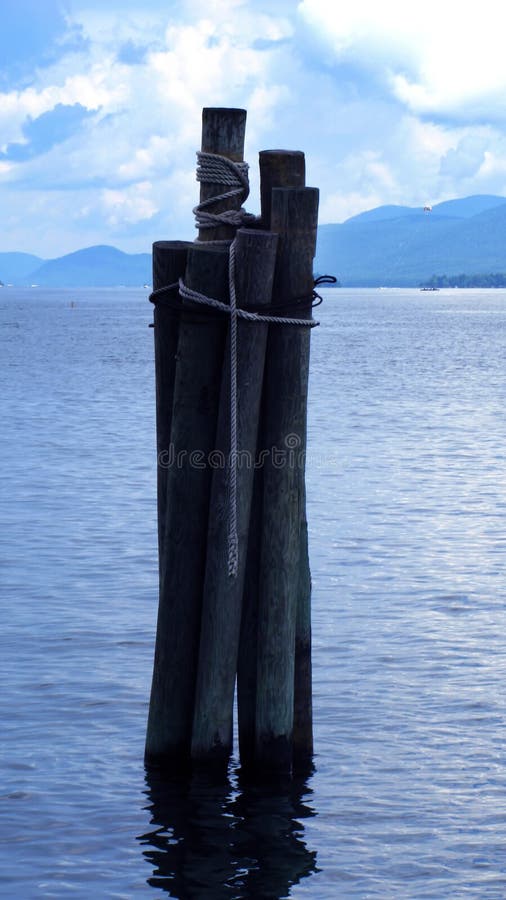 Wood in Water stock photo. Image of string, lake, clouds - 6059318