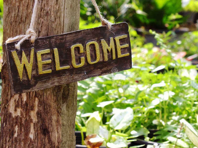 Welcome Sign Hanging in the Garden Stock Photo - Image of hanging ...