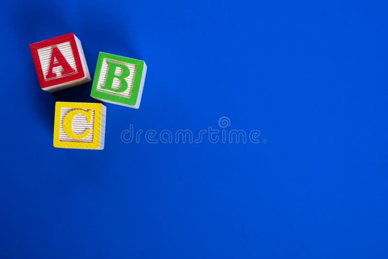 Wooden ABC Blocks on Blue Background Stock Image - Image of elementary ...