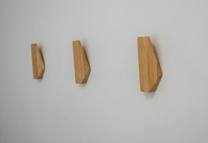 Wooden Abstract Wall Hook Mounted Against Wall Stock Photo - Image of ...