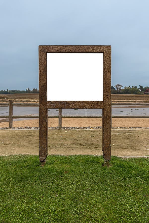 Wooden Advertising Frame by the River, in a Grass Field Under a Pale ...