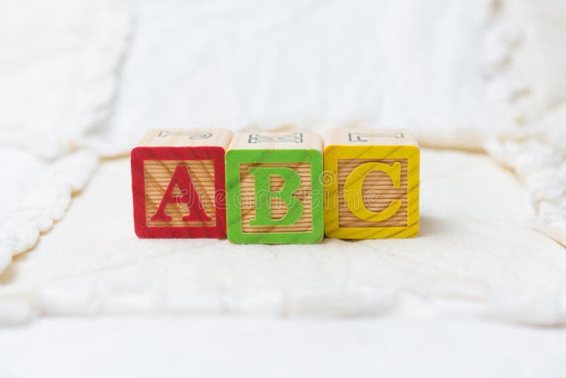 Wooden Alphabet Blocks on Quilt Spelling ABC Horizontal Stock Photo ...