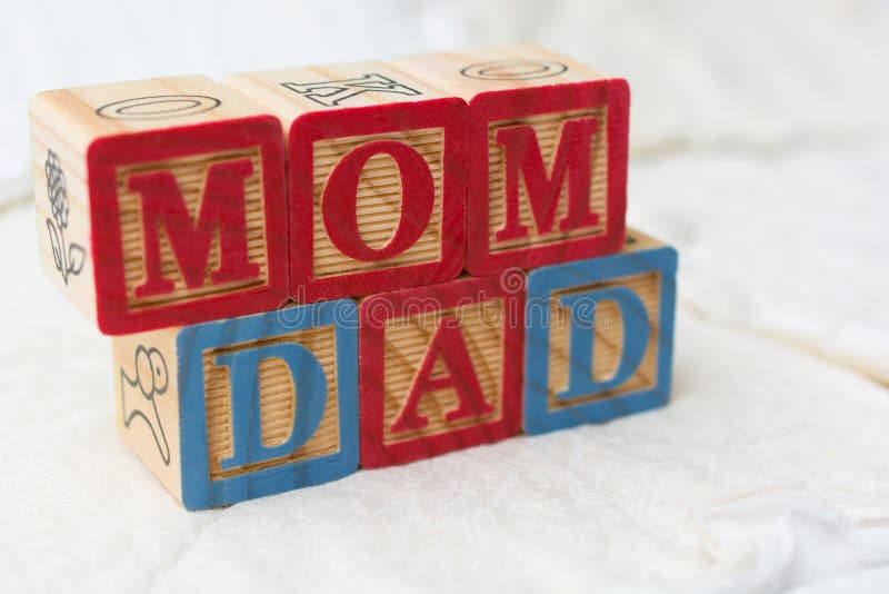 Wooden Alphabet Blocks on Quilt Spelling Mom and Dad Stock Image ...