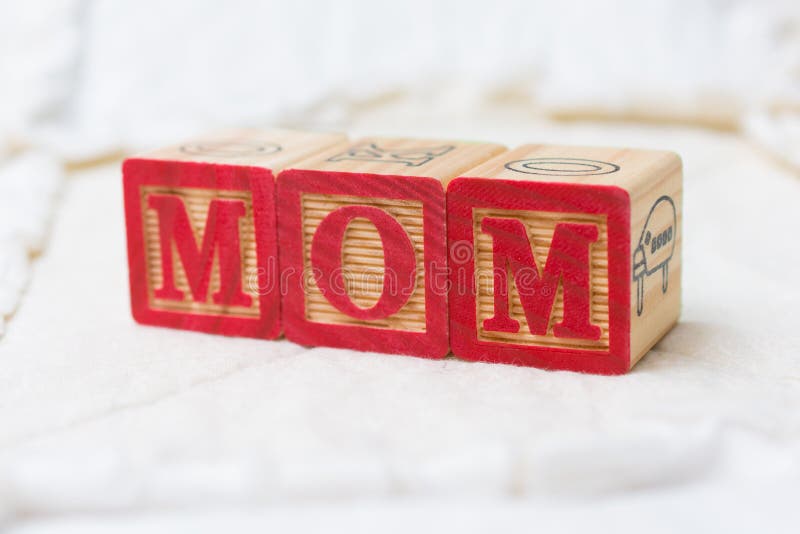 Wooden Alphabet Blocks on Quilt Spelling Mom Stock Image - Image of ...
