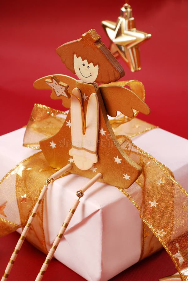 Wooden Angel Sitting on Gift Box Stock Photo - Image of sitting ...