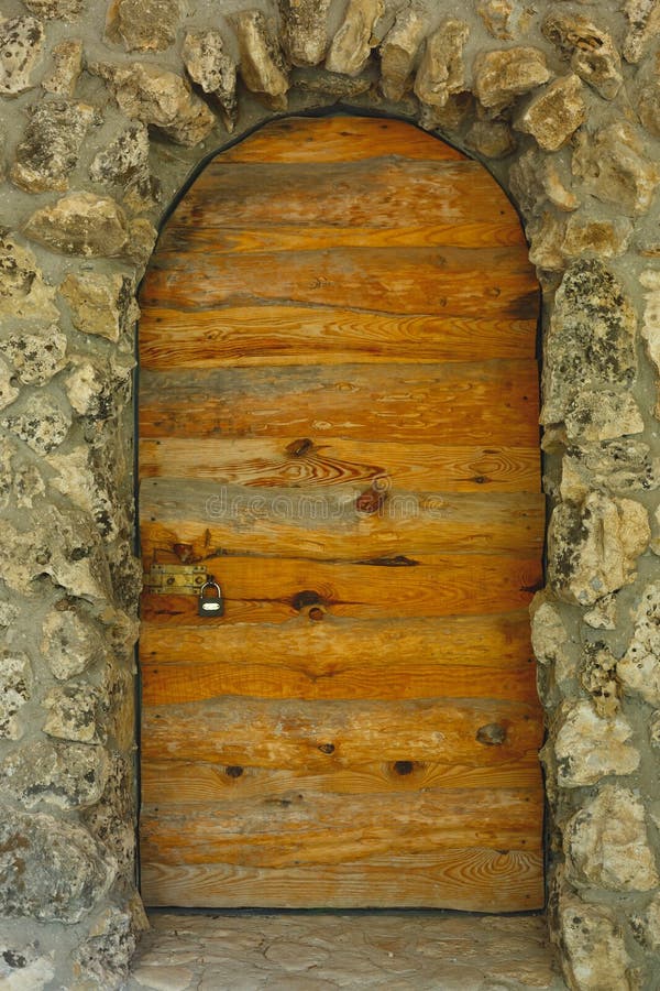 Wooden Antique Door with a Lock in a Stone Wall Stock Photo - Image of ...