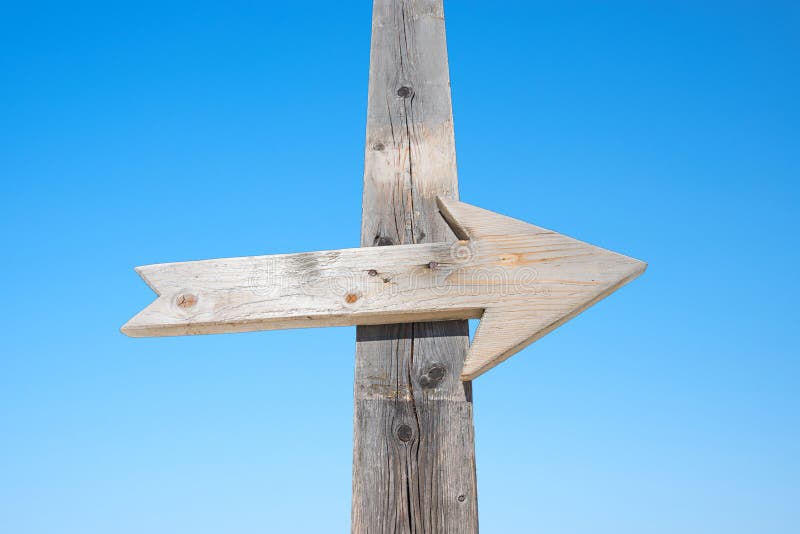 Wooden Arrow on a Post, with Blue Sky in the Background Stock Photo ...