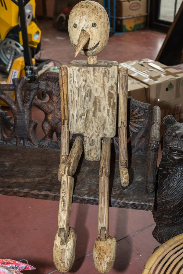 Wooden Articulated Puppet Sitting on a Bench Stock Image - Image of ...