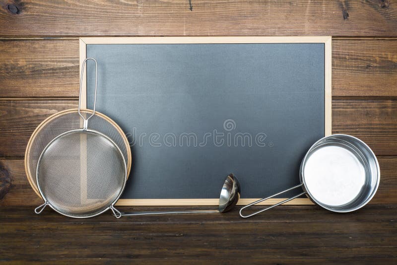 Wooden Background with a Chalkboard and Cooking Utensils Stock Photo ...